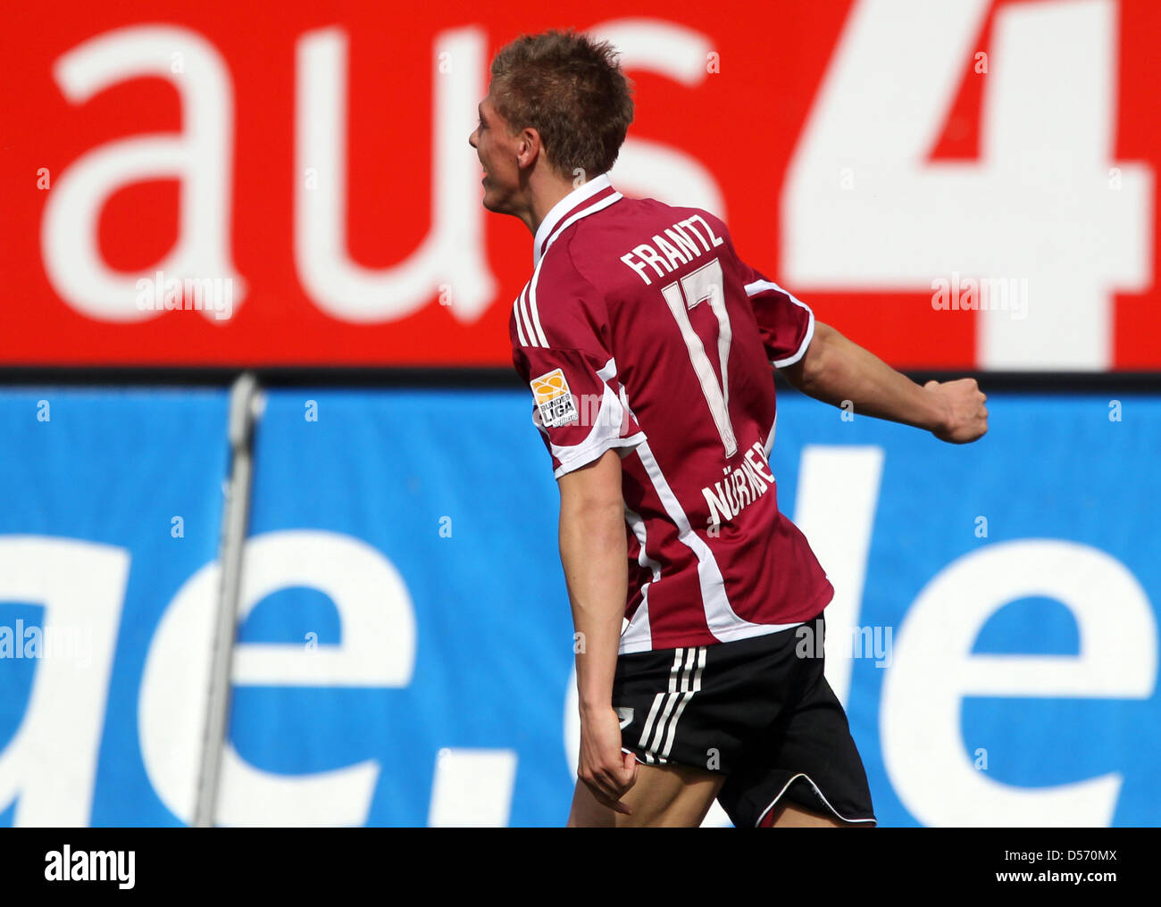 Nuremberg's Mike Frantz (L) cheers about his goal to the score 1-0 ...