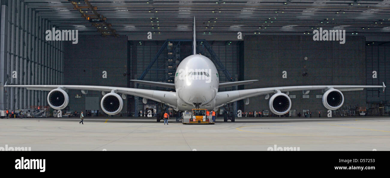 An Airbus A380 is hauled into a hangar at the airport in Frankfurt/Main ...
