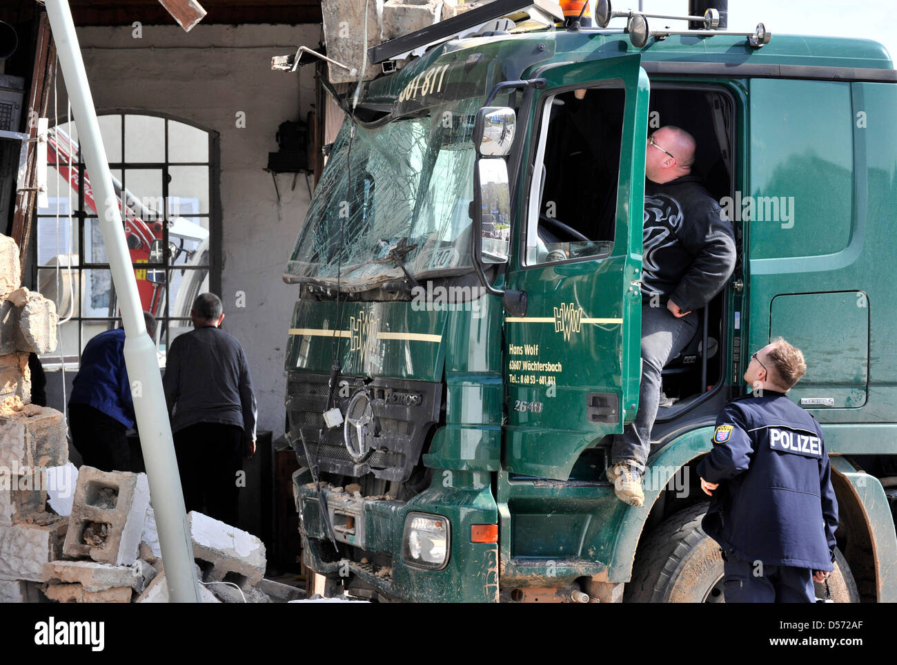 Police inspects the scene of accident of a lorry that crashed into the ...