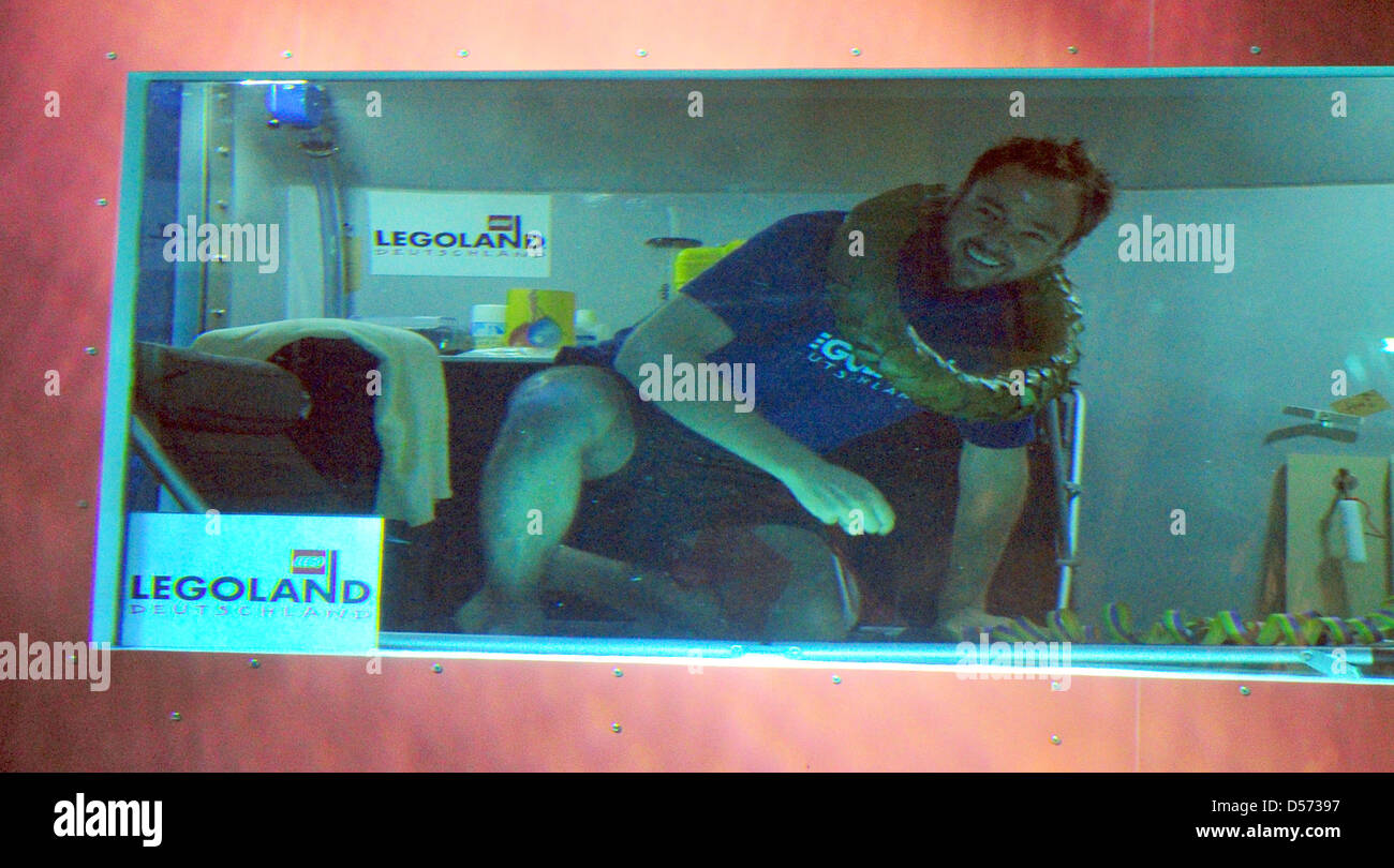 Lloyd Godson sits in his container house in Legoland near Guenzburg ...