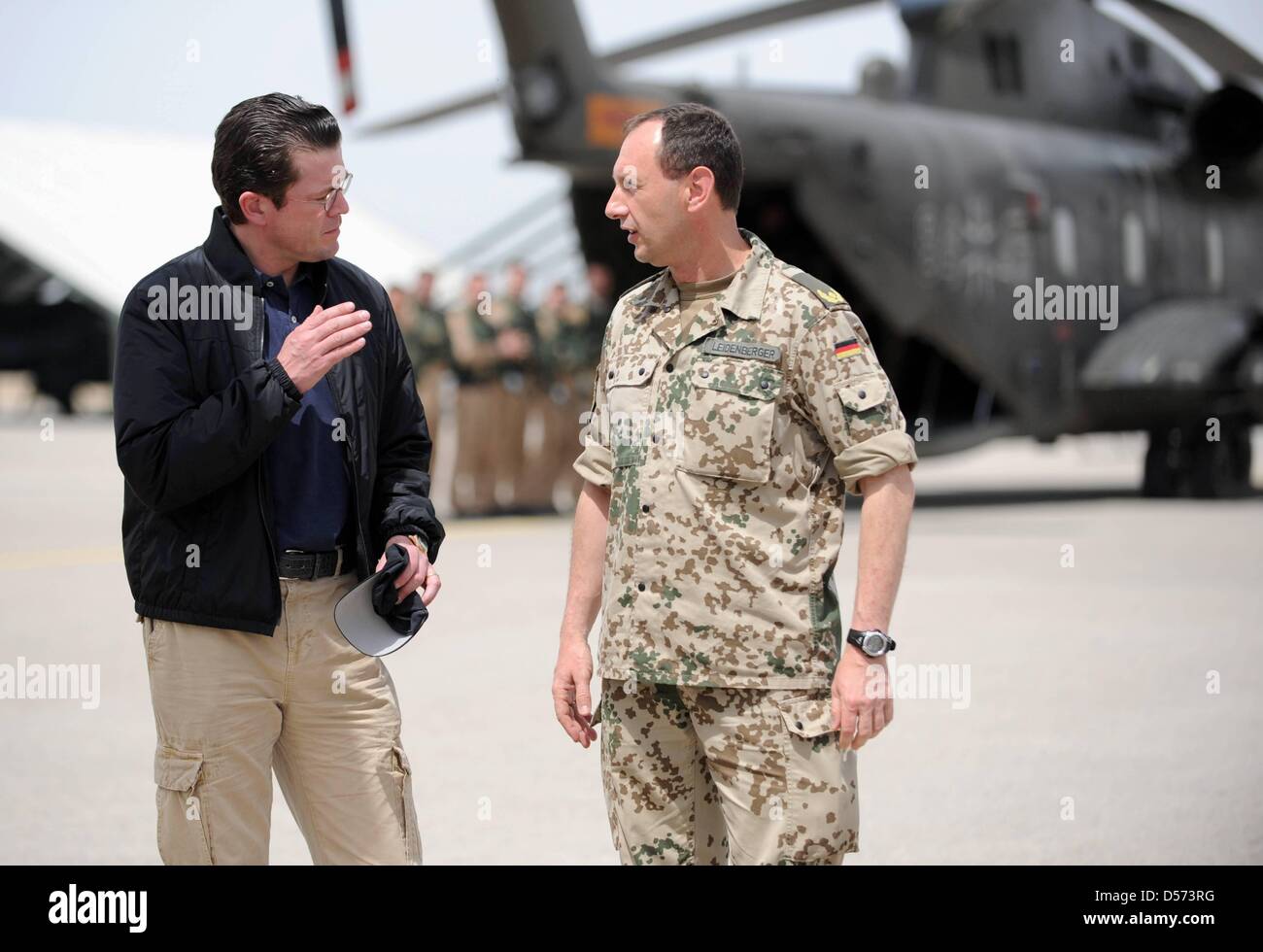 German Minister of Defence Karl-Theodor zu Guttenberg (L) is welcomed ...