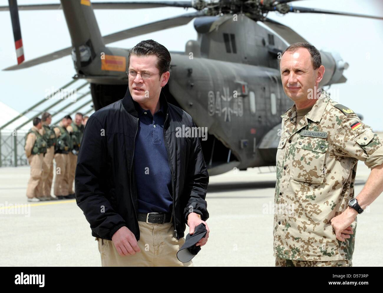 German Minister of Defence Karl-Theodor zu Guttenberg (L) is welcomed ...