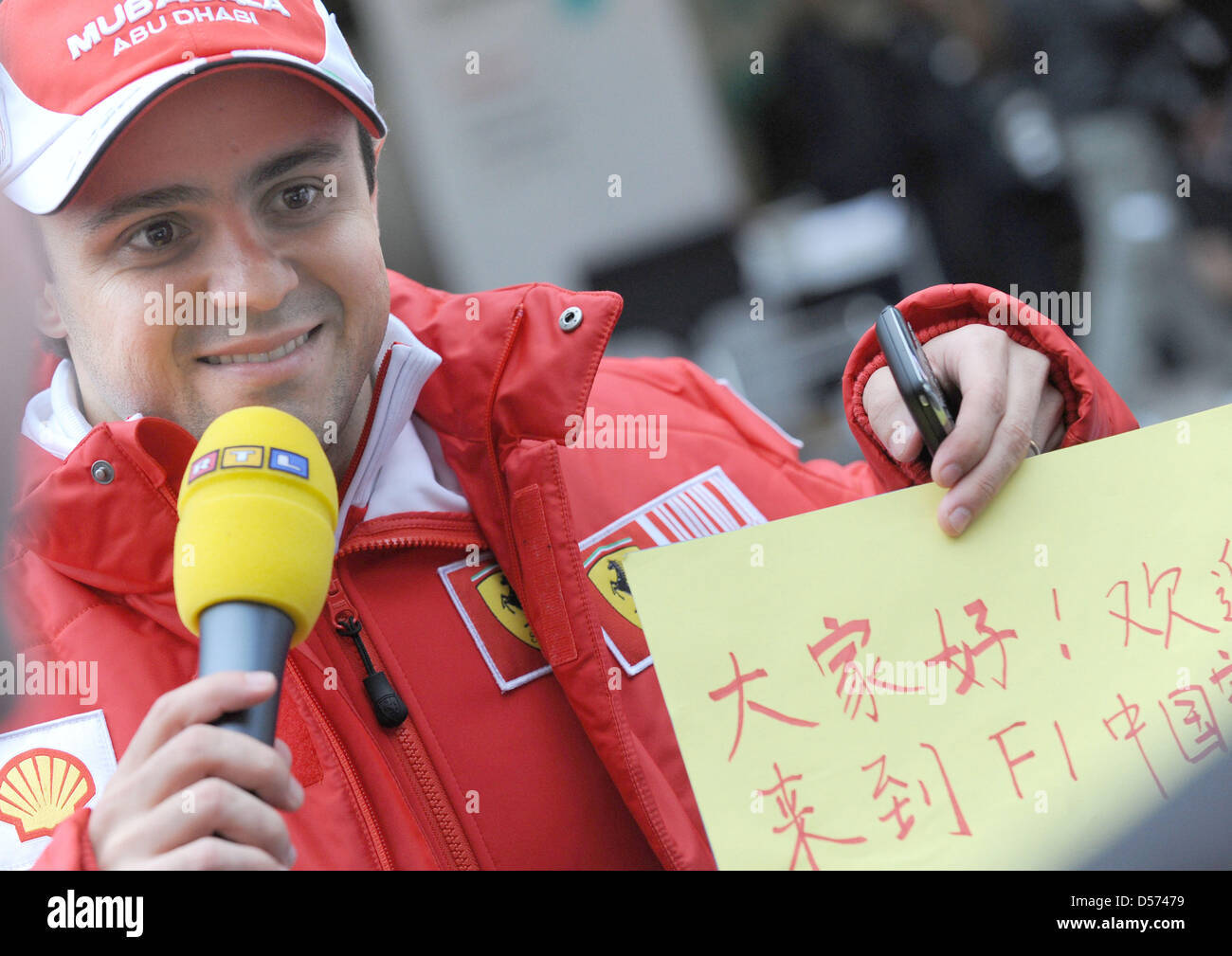 Brazilian Formula One driver Felipe Mass of Ferrari holds Chinese ...