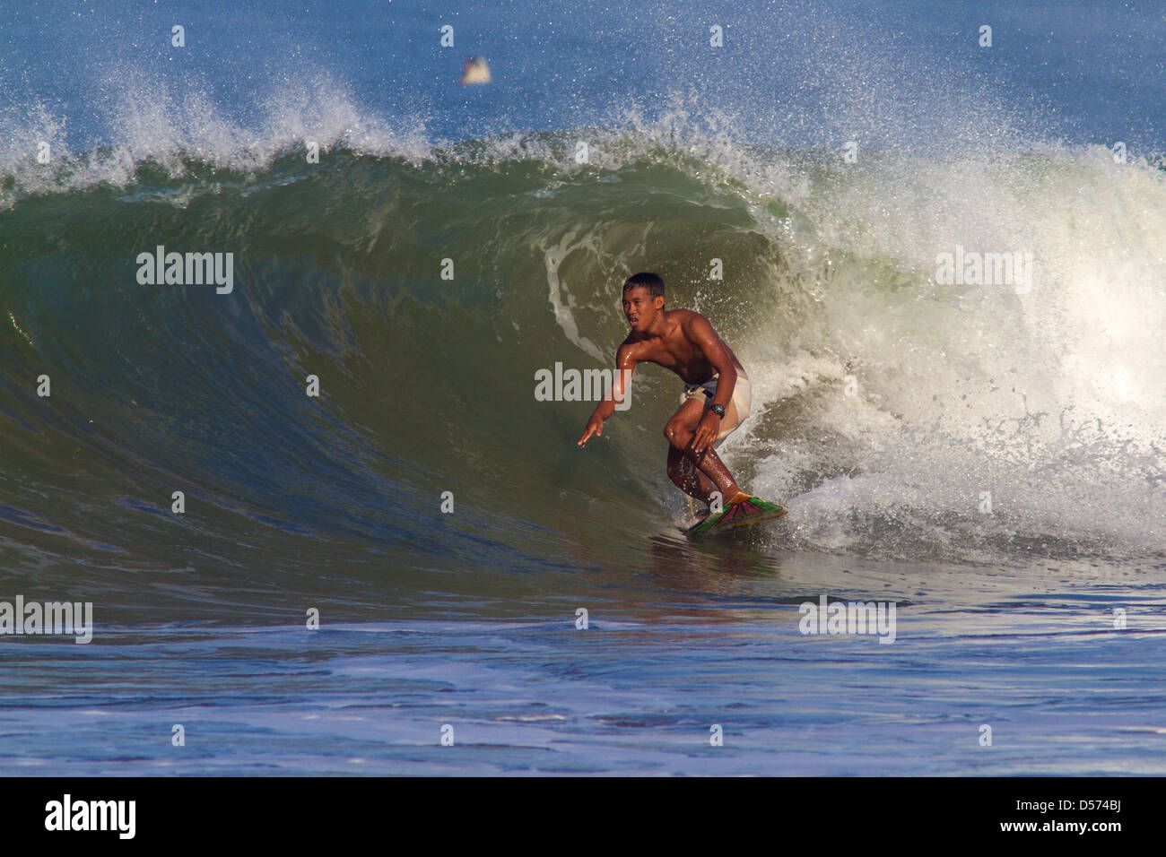 Surfing a wave.Kuta.Bali.Indonesia Stock Photo - Alamy