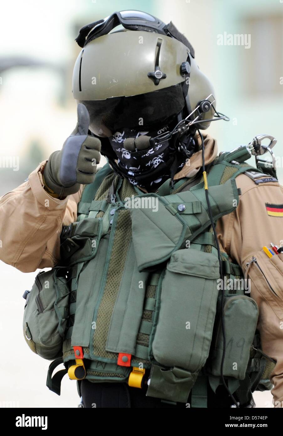 A crew member of a German Bundeswehr helicopter gives thumbs up at the ...