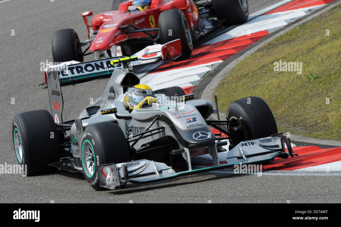German Nico Rosberg of Mercedes GP races during a practice session for ...