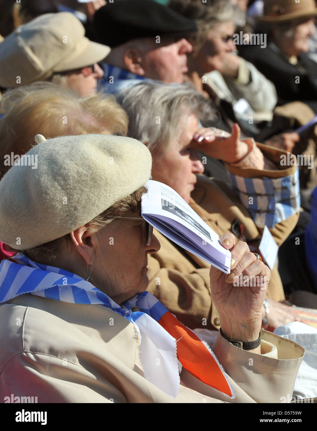 Survivors and relatives watch as artists of Paris-based Theatre du ...