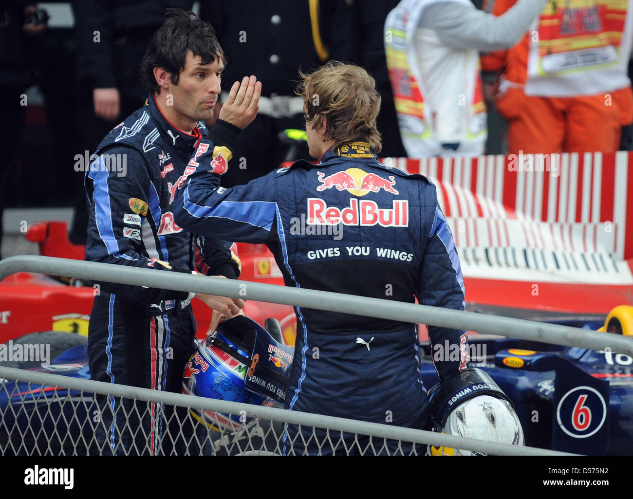 German driver Sebastian Vettel of Red Bull Racing (R) and his ...