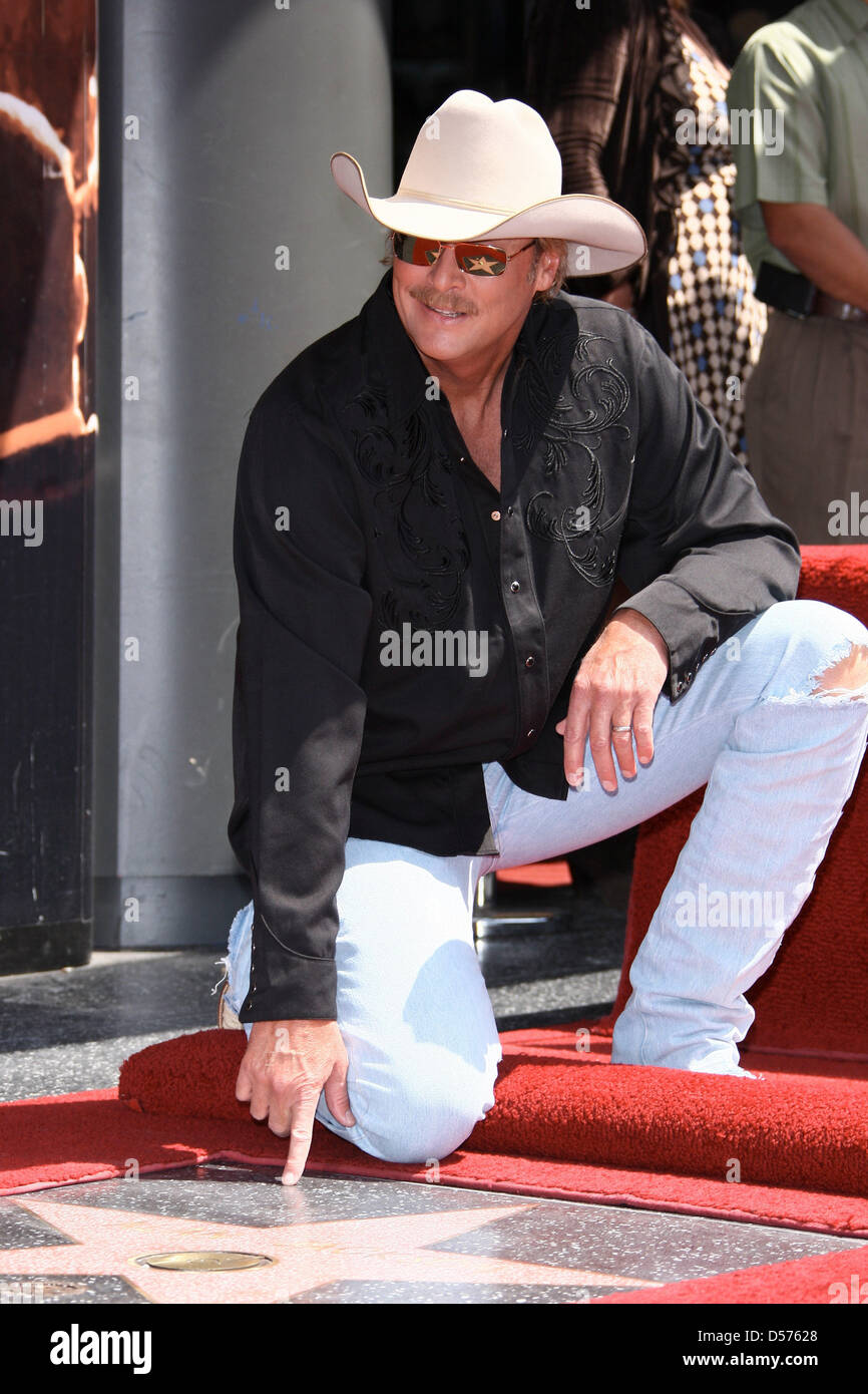 US country and western singer Alan Jackson poses as he receives the 2 ...