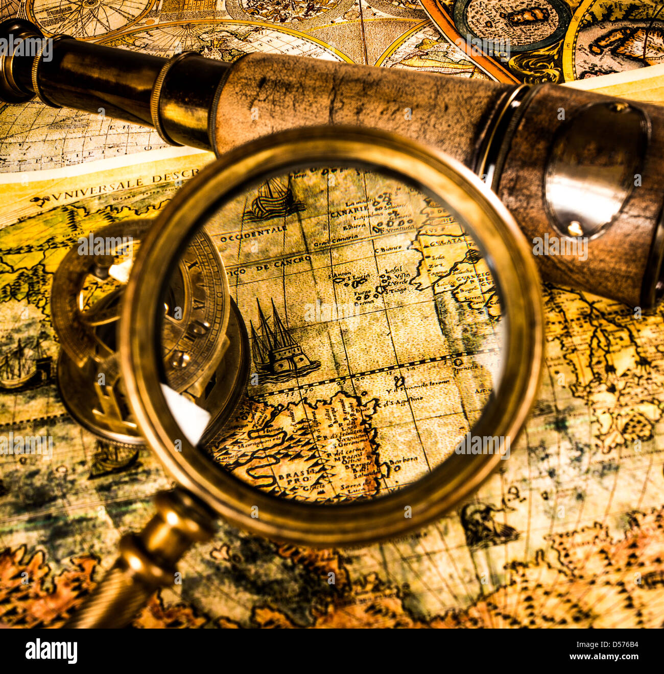 Vintage magnifying glass, compass, telescope lying on an old map Stock ...