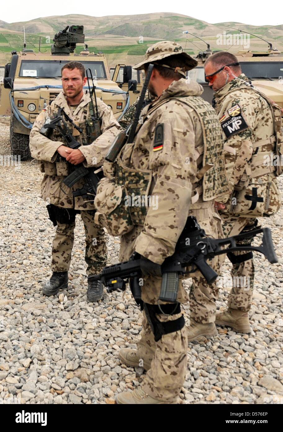 Soldiers of the German Bundeswehr confer previous to a deployment at ...