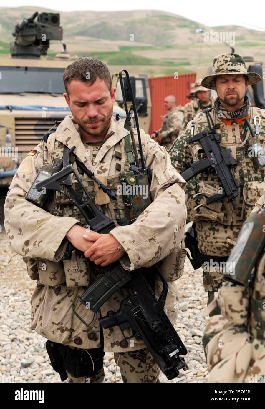 Soldiers of the German Bundeswehr confer previous to a deployment at ...