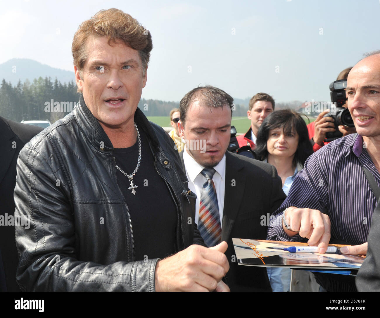 US actor and singer David Hasselhoff (L) gives autographs during his ...