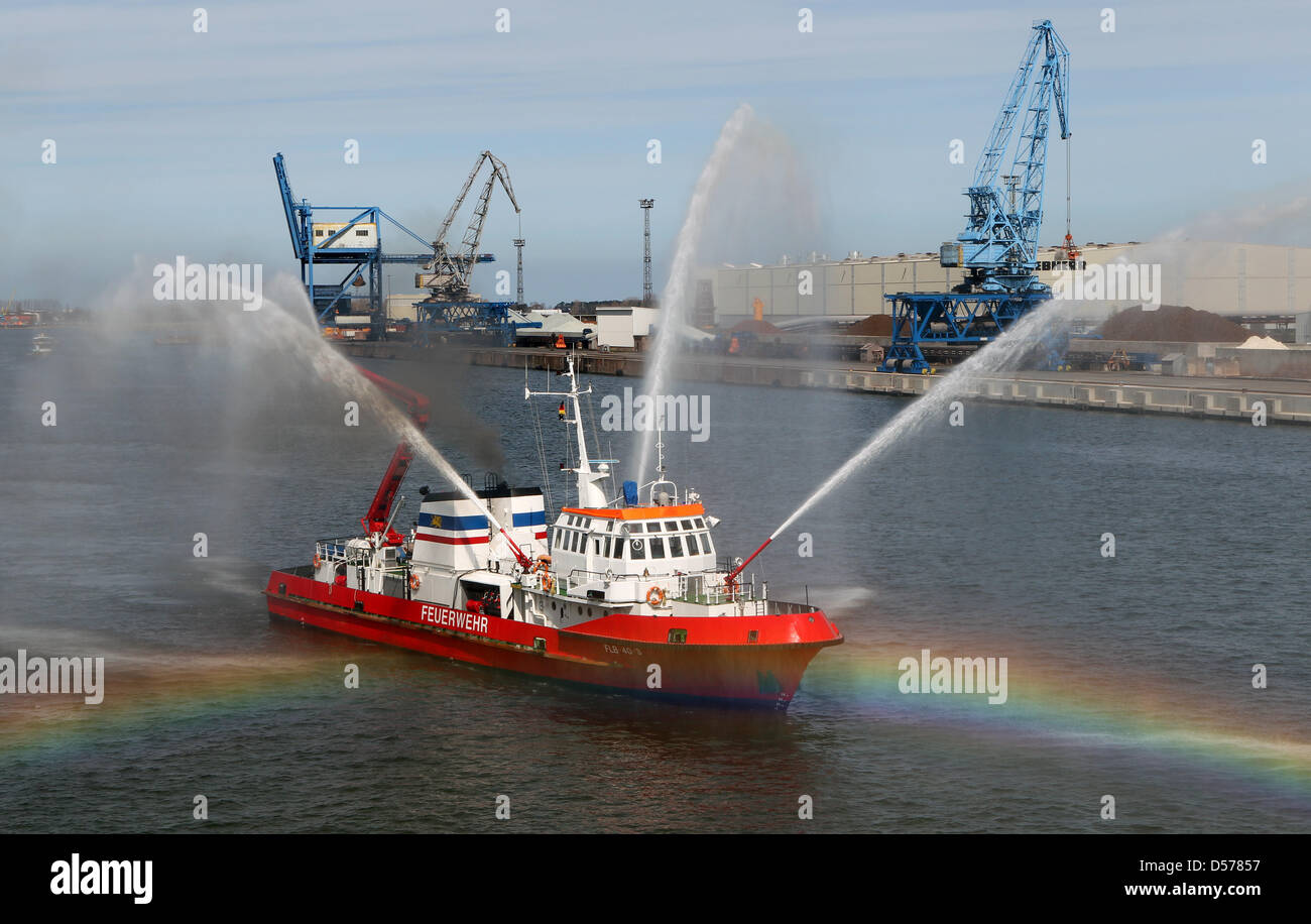 A fireboat demonstrates his techniques, where a rainbow appears in the ...