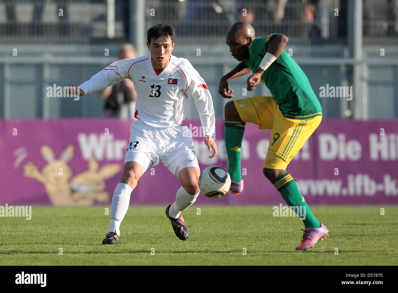 North Korea's Pak Chol Jin and South Africa's Katlego Mphela (R) vie ...