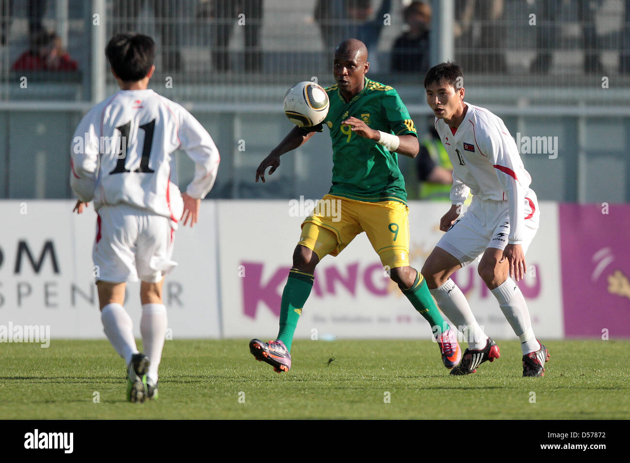 North Korea's Pak Chol Jin (R) and South Africa's Katlego Mphela vie ...