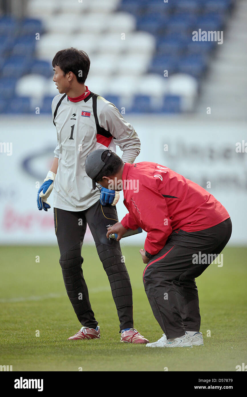 North Korea's team doctor takes care of goal keeper Ri Myong Guk during ...