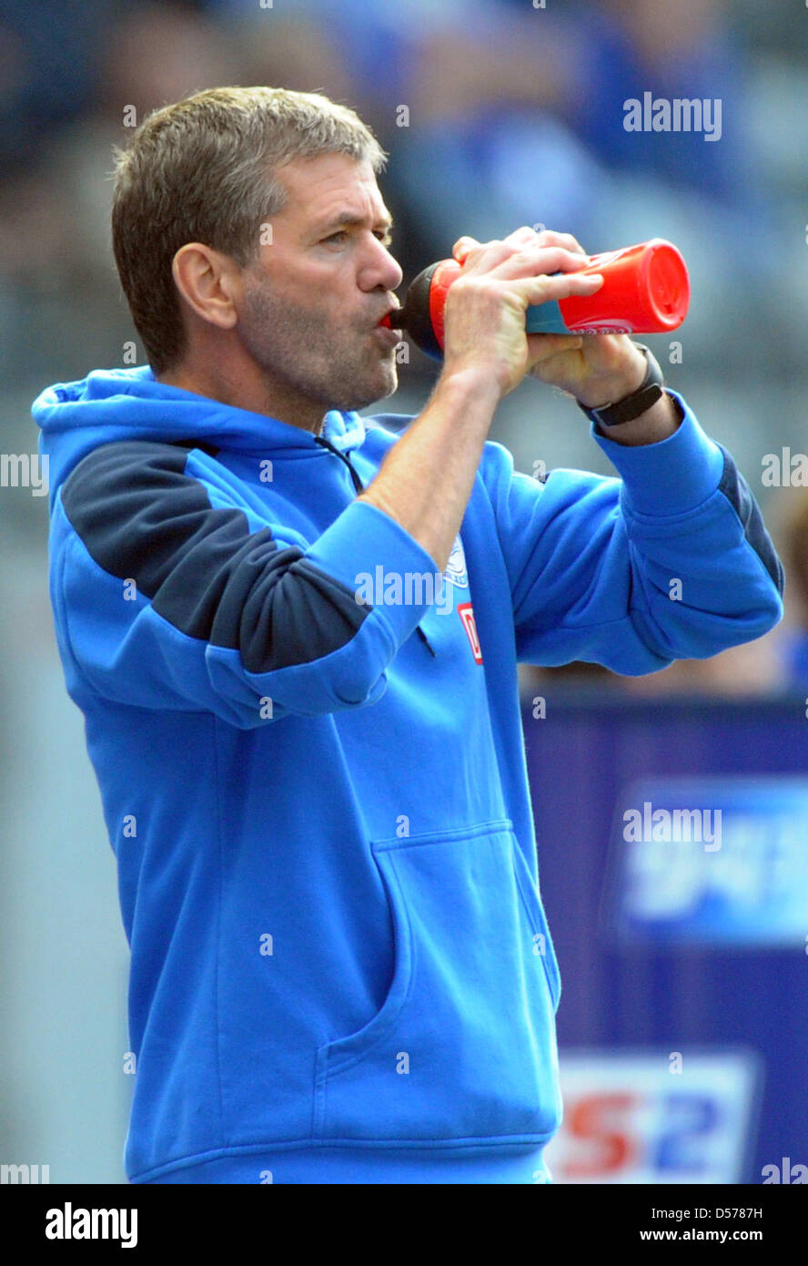 Berlin's coach Friedhelm Funkel drinks water during German Bundesliga ...