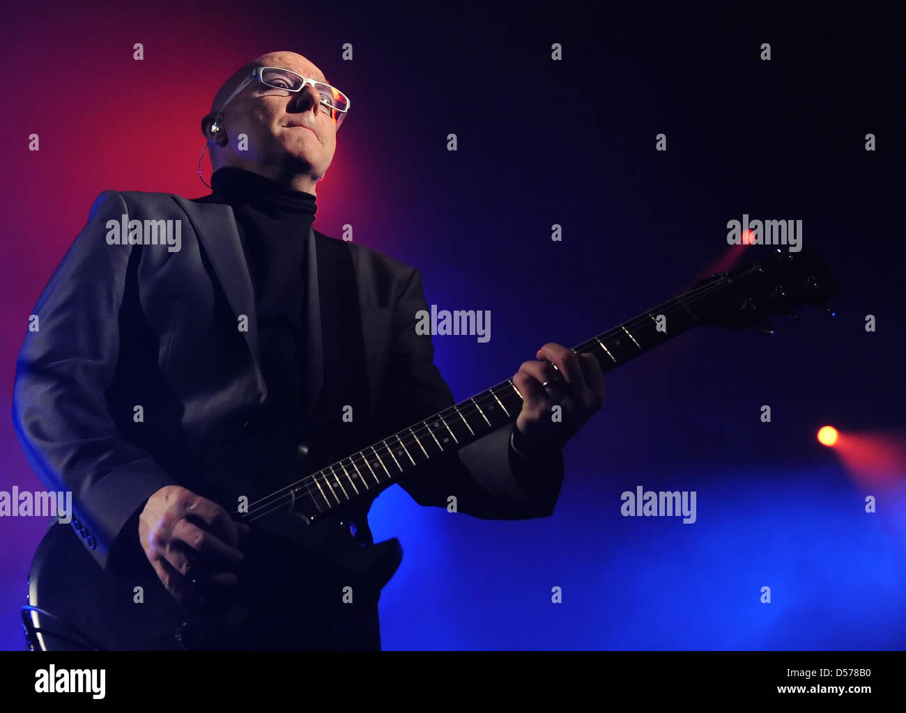 Singer Midge Ure Of The British Band Ultravox Stands On Stage At