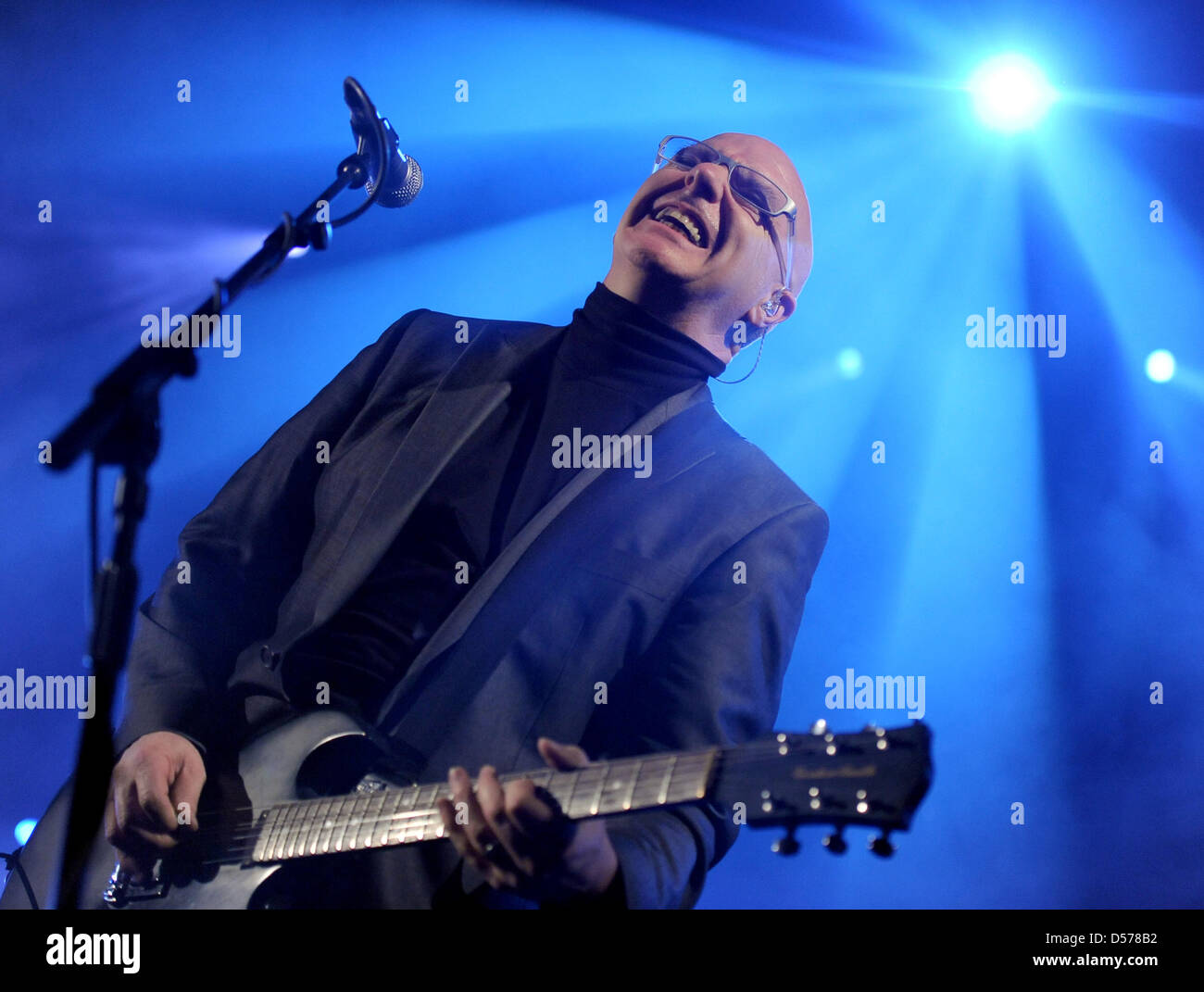 Singer Midge Ure of the British band Ultravox stands on stage at ...