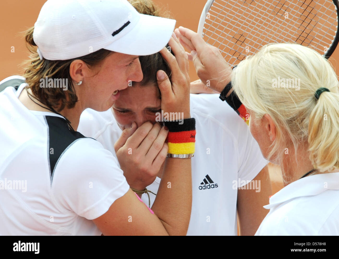 Germany's Andrea Petkovic (C), Kristian Barrois (L) and team leader ...