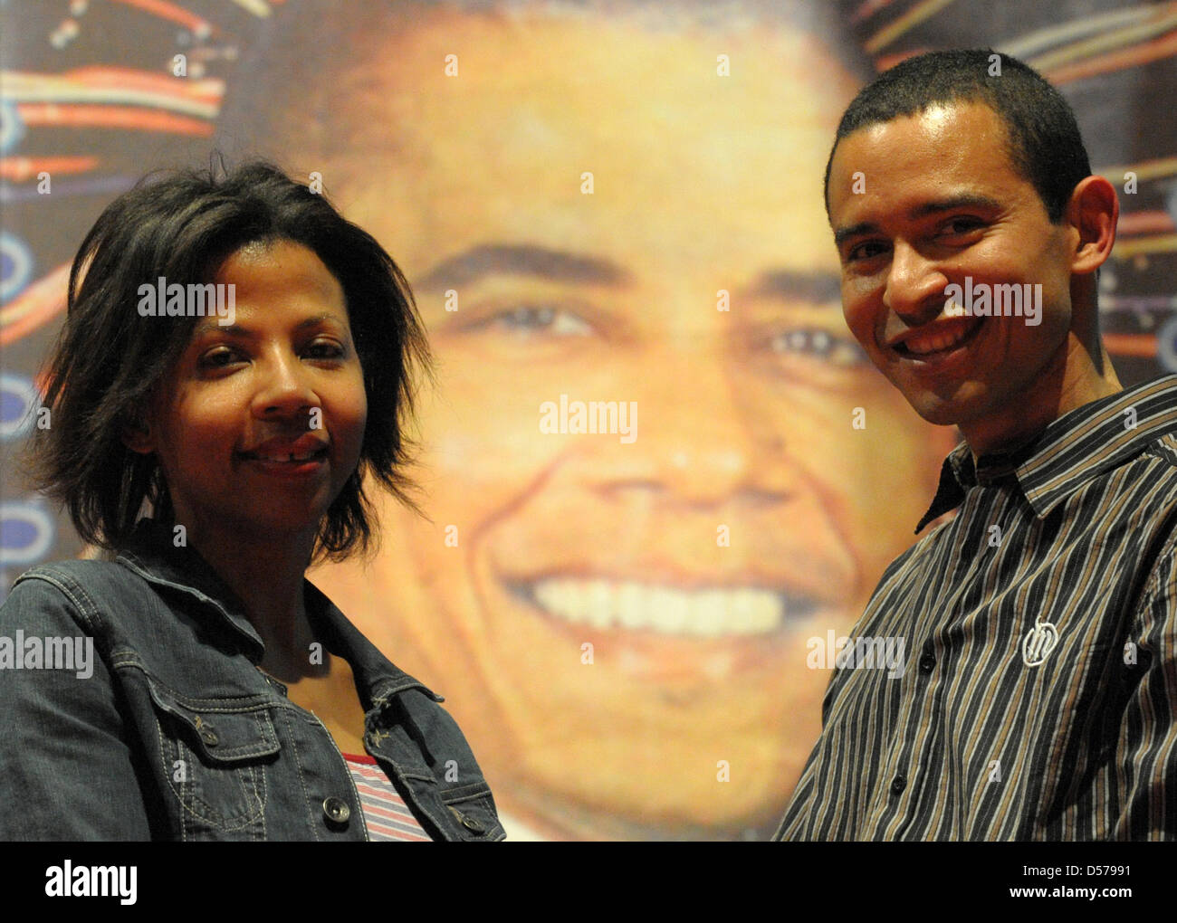 Supernumeraries Joni Smith (L) and Wilson Vanegas pose on the stage ...
