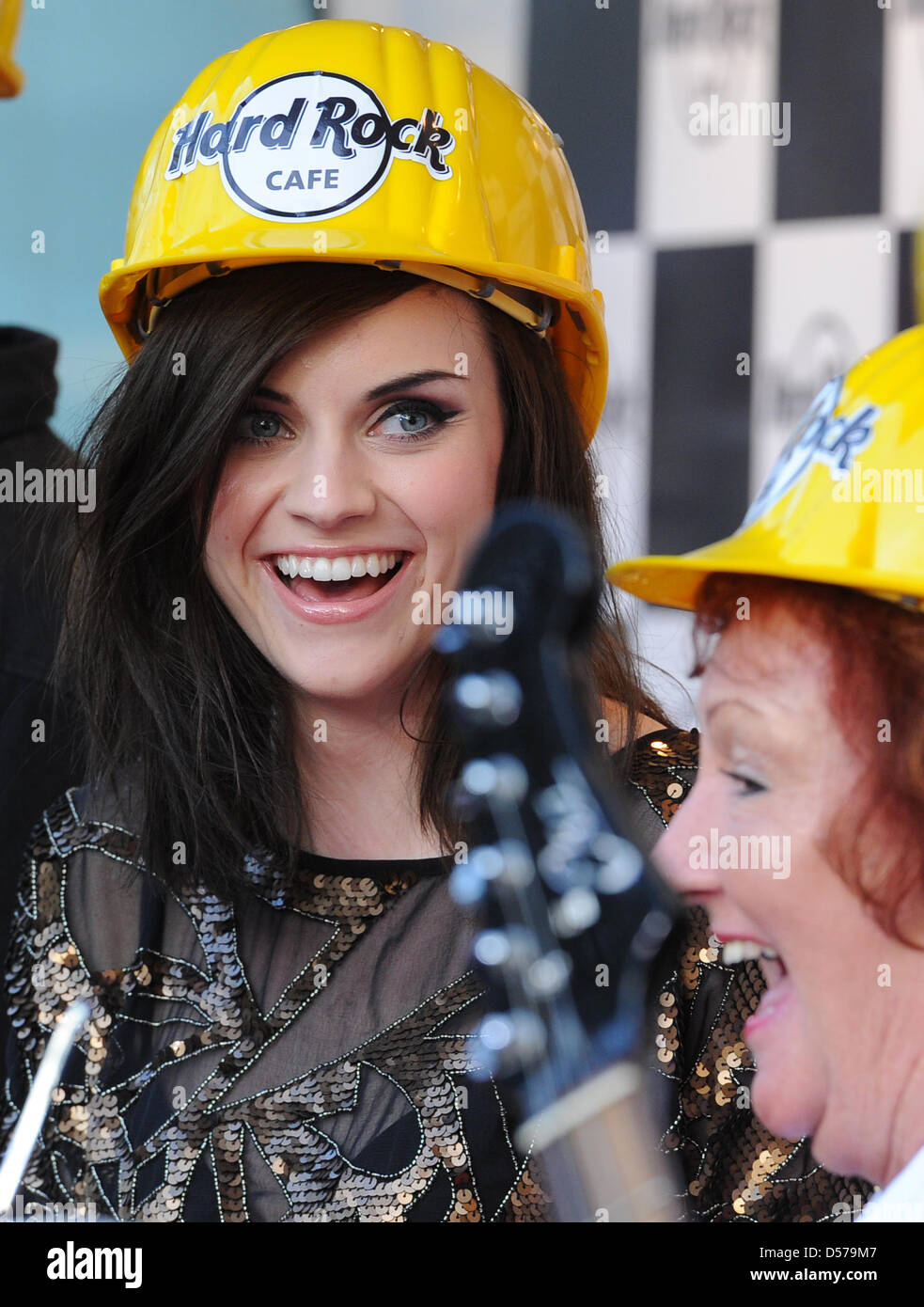Scottish singer Amy Macdonald (L) laughs and weras a helmet at the ...