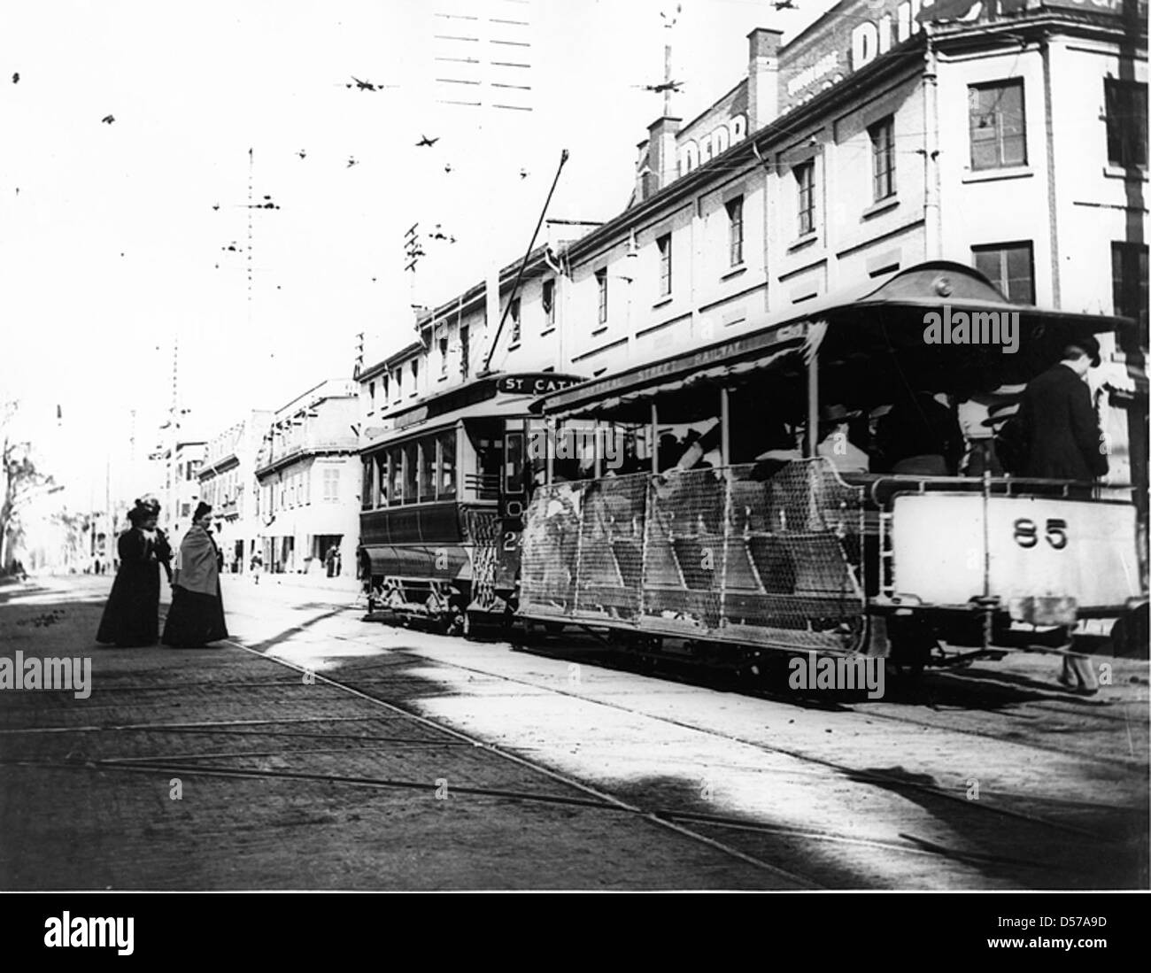 This photograph captures a wire-sided tram on Ste. Catherine Street in ...