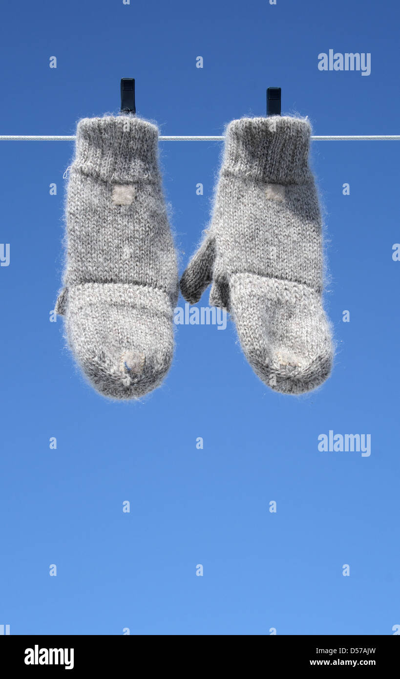 Mittens on the clothes-line hanging to dry – the winter is over Stock ...