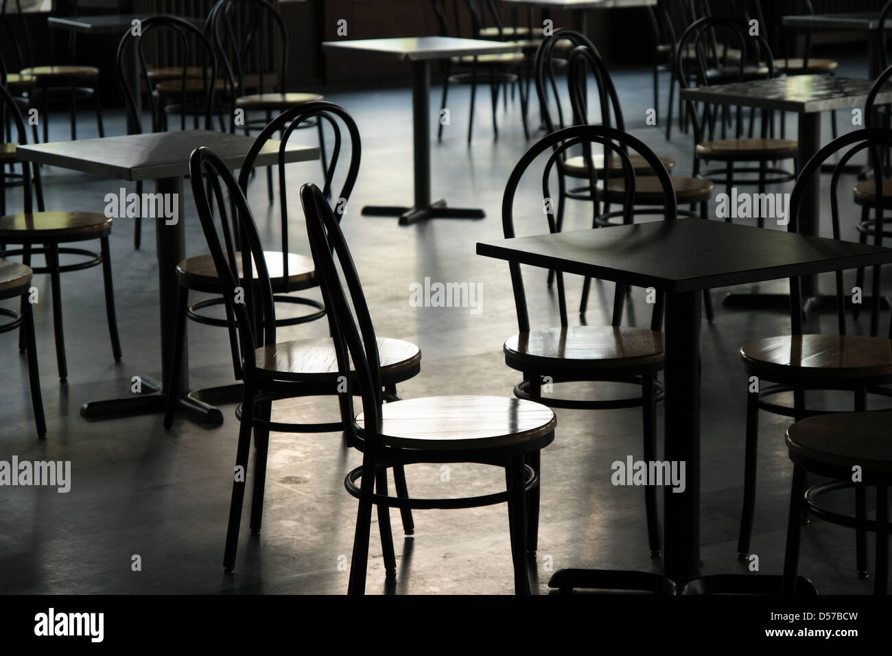 Tables and chairs in a cafeteria. Light coming from the window Stock ...