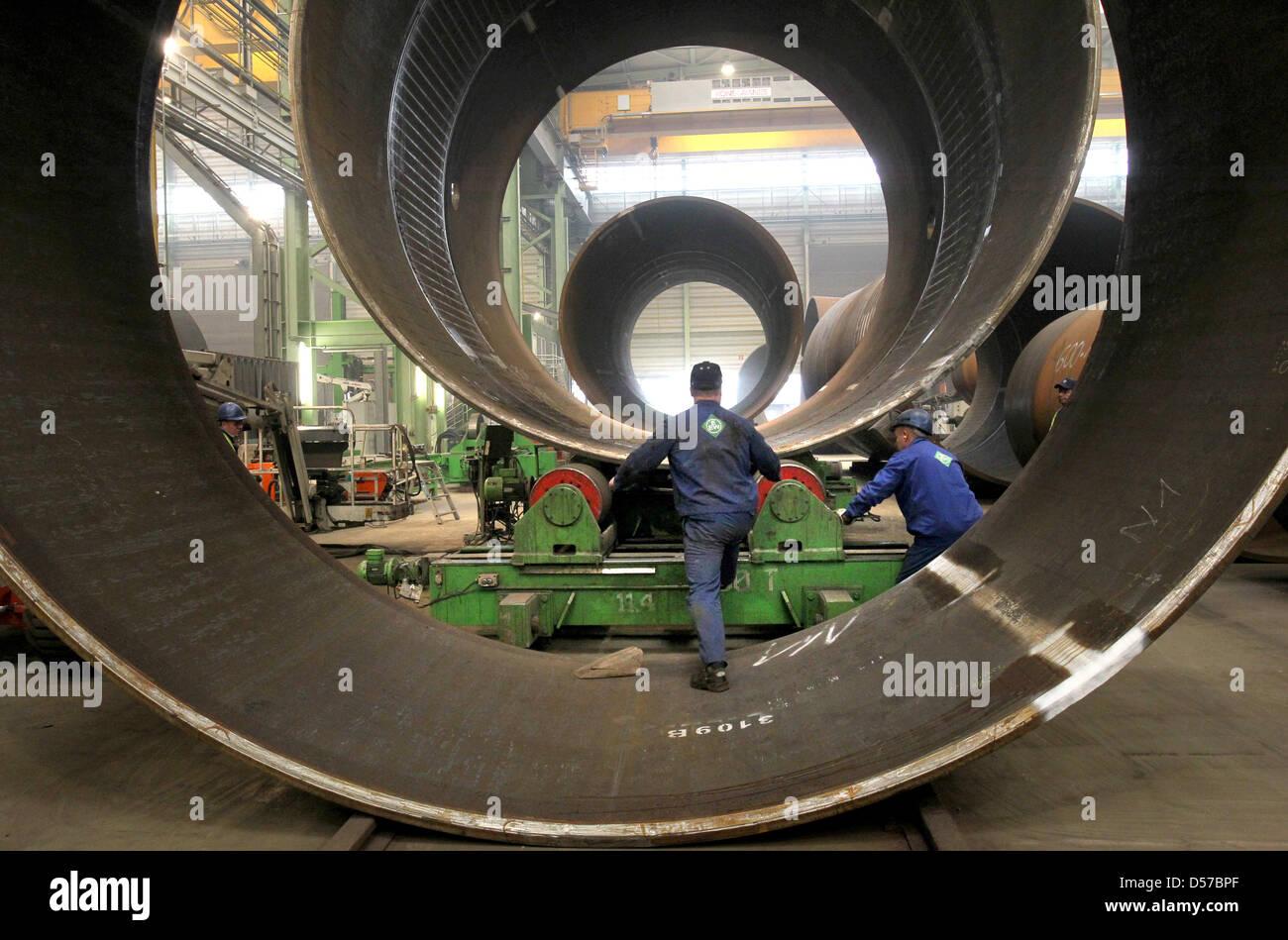 Staff members of EEW Special Pipe Conmstructions weld segments for an ...