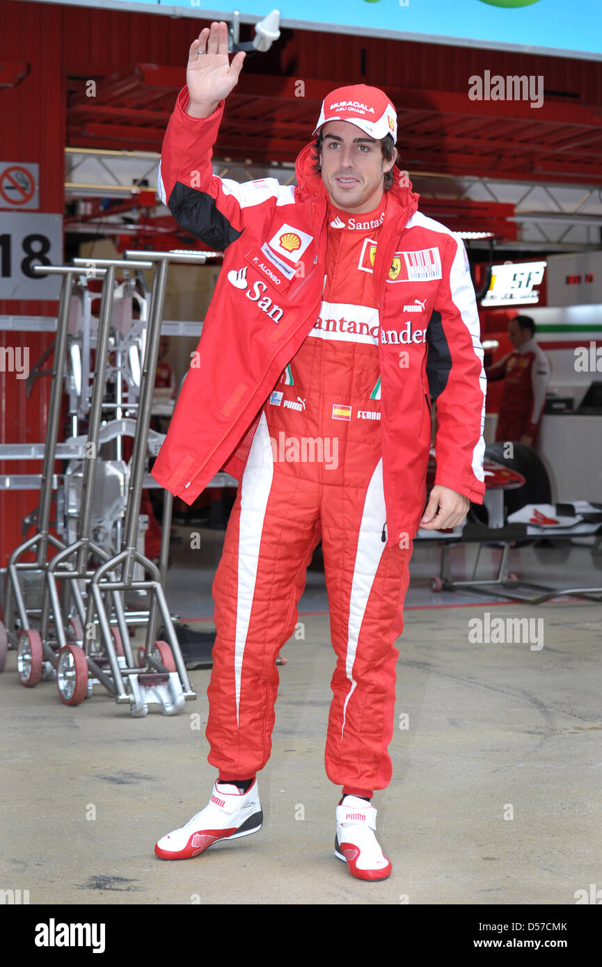 Spanish driver Fernando Alonso of Ferrari stands in the paddock of ...