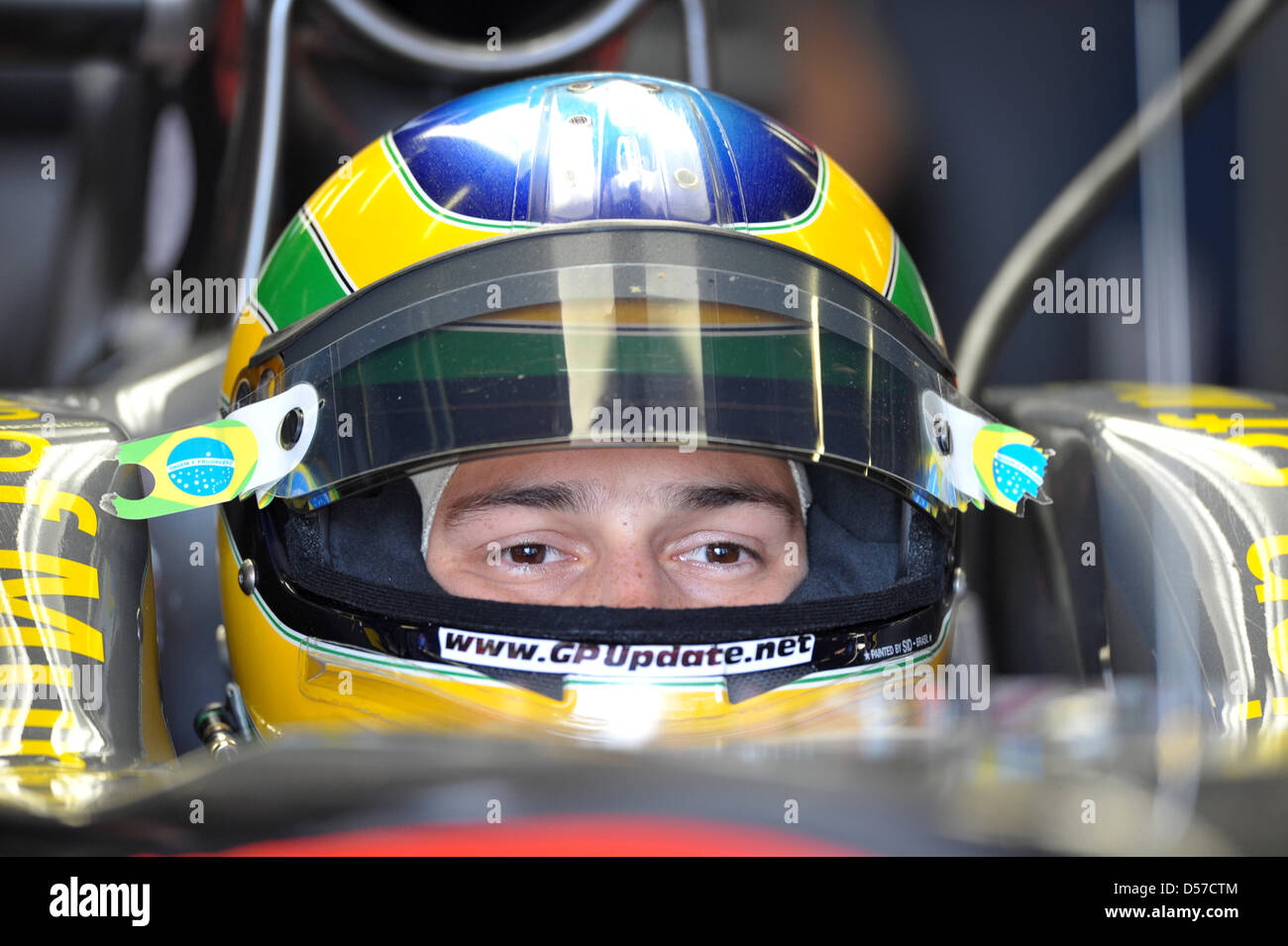 Brazilian driver Bruno Senna of Team Hispania sits in his car prior to ...