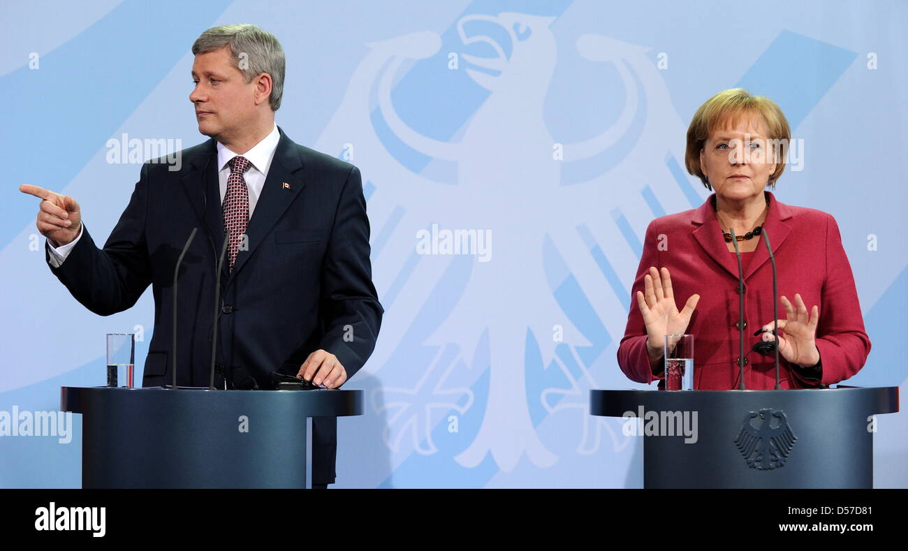 German Chancellor Angela Merkel (R) and Canadian Prime Minister Stephen ...