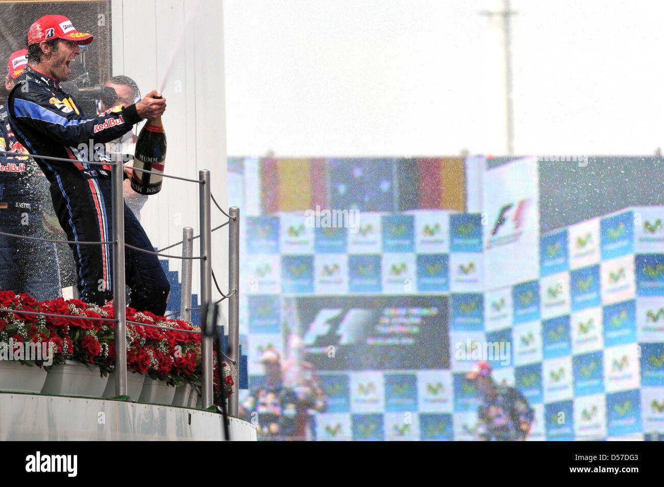 Australian driver Mark Webber of Red Bull Racing celebrates his victory ...