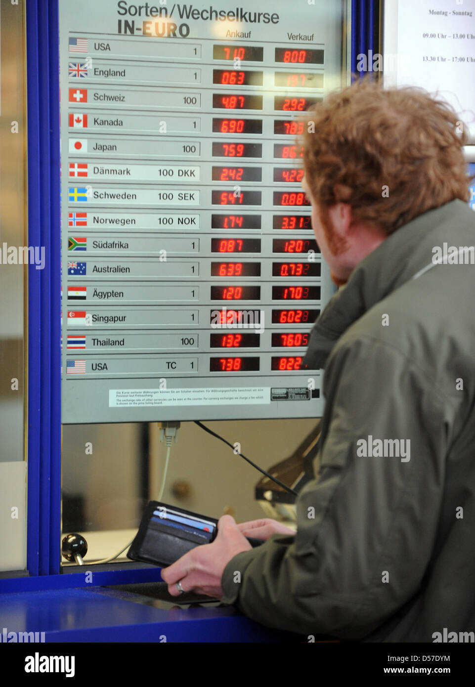 Man exchanges money in hi-res stock photography and images - Alamy