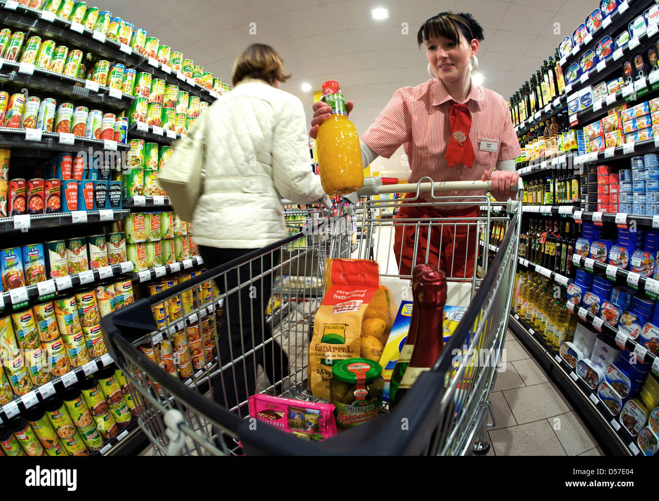 A staff member of Retail Cooperative Leipzig eG board assembles a ...