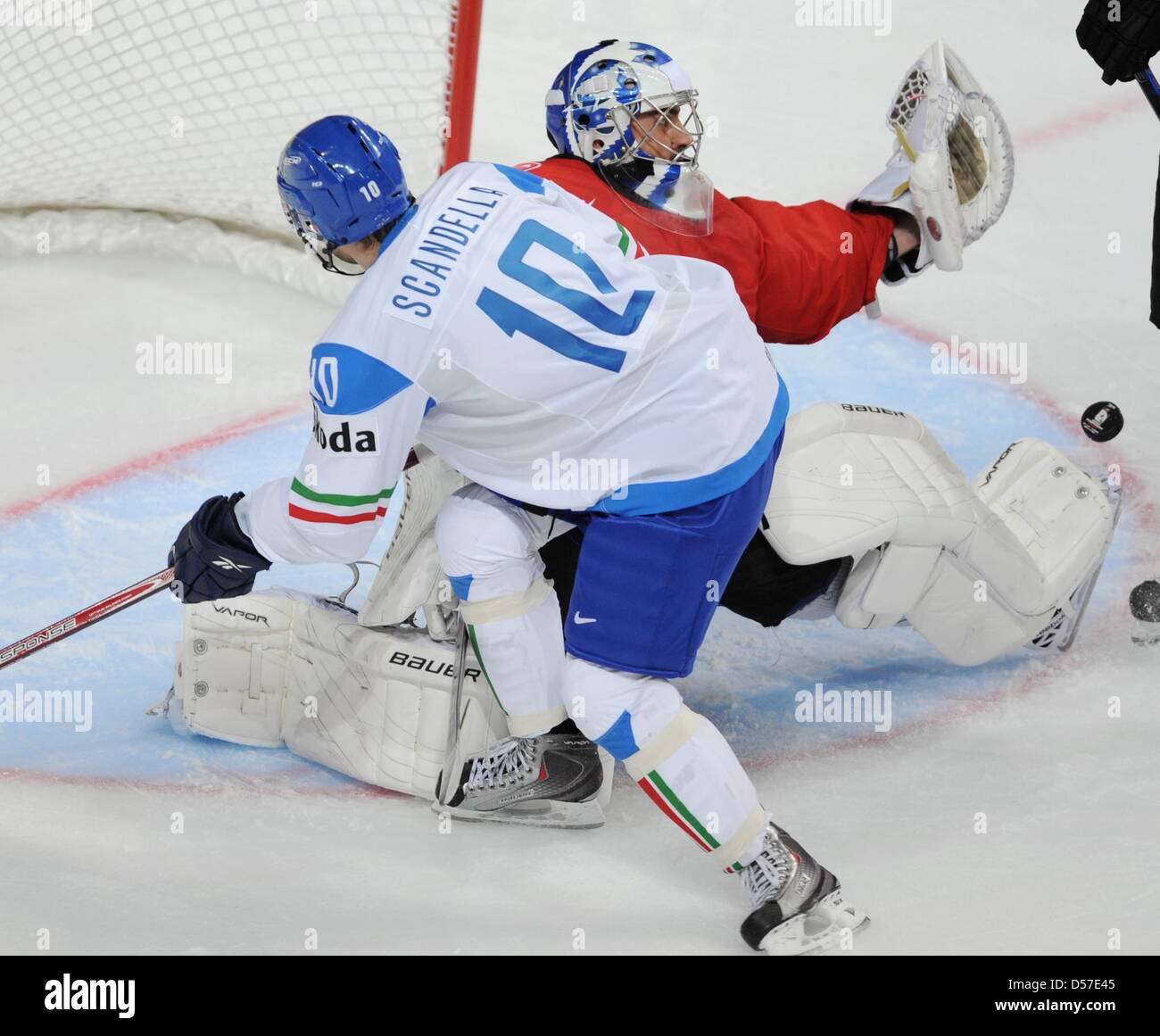 Swiss goalkeeper Martin Gerber (R) and Italy's Guilio Scandella in ...