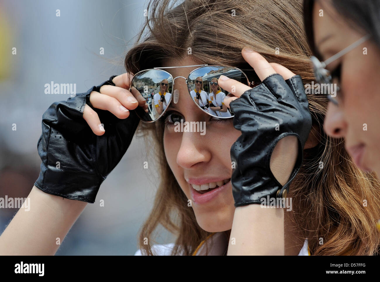 Models pose in fashionable suits of Renault F1 Team in Monaco's harbour ...