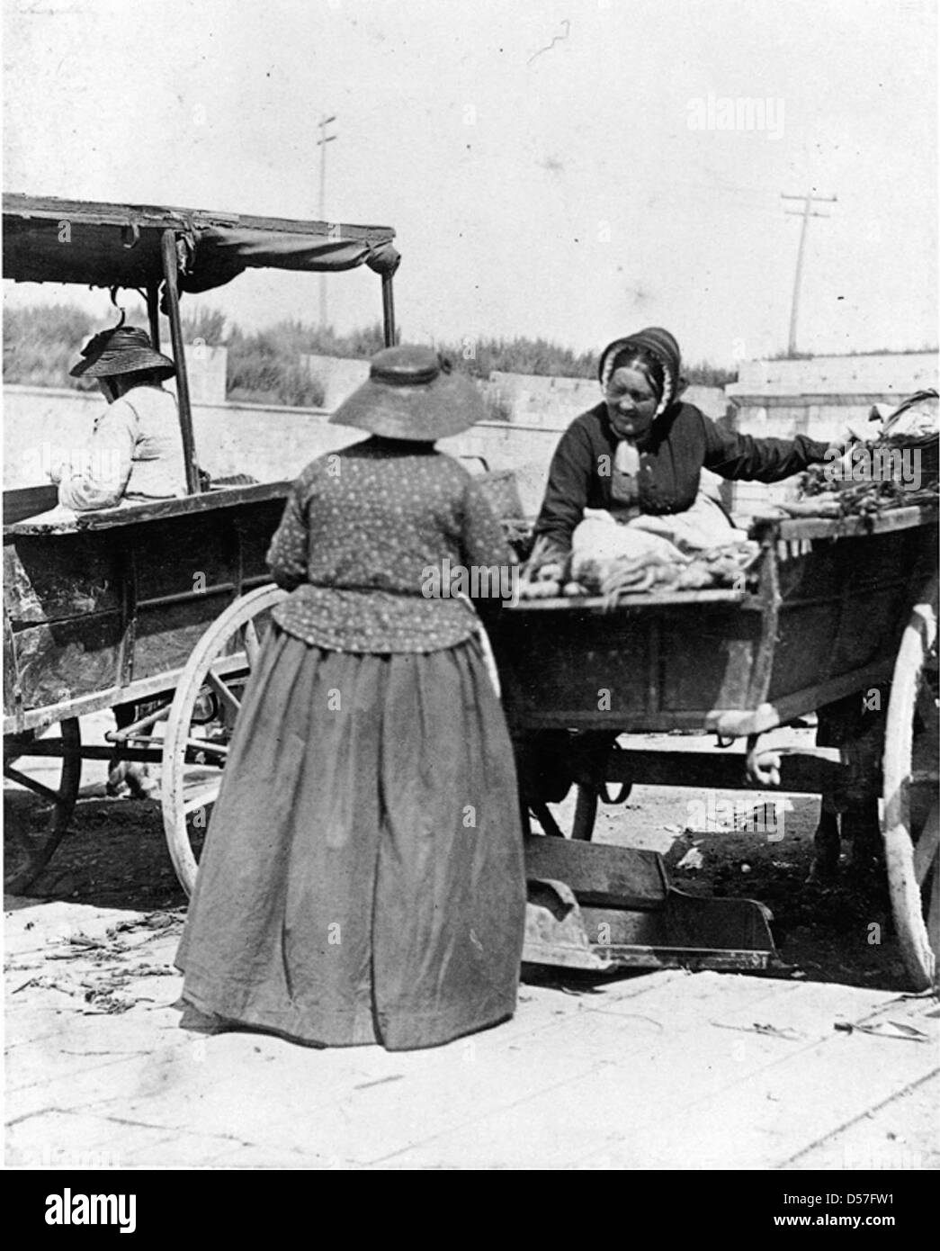 A photograph of vendors at the Montcalm Market in Quebec City around ...