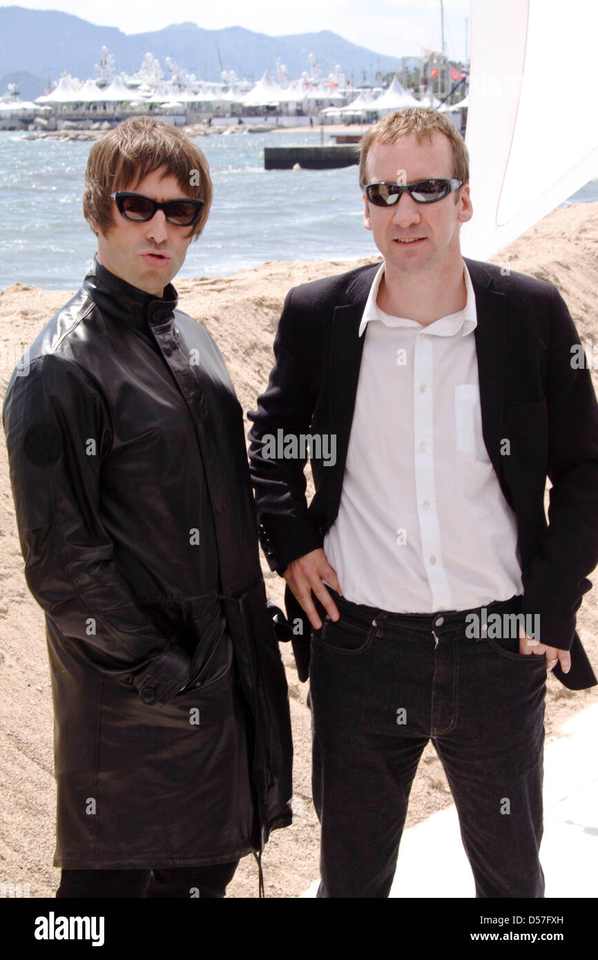 British singer Liam Gallagher (L) and producer Andrew Eaton (R) pose ...