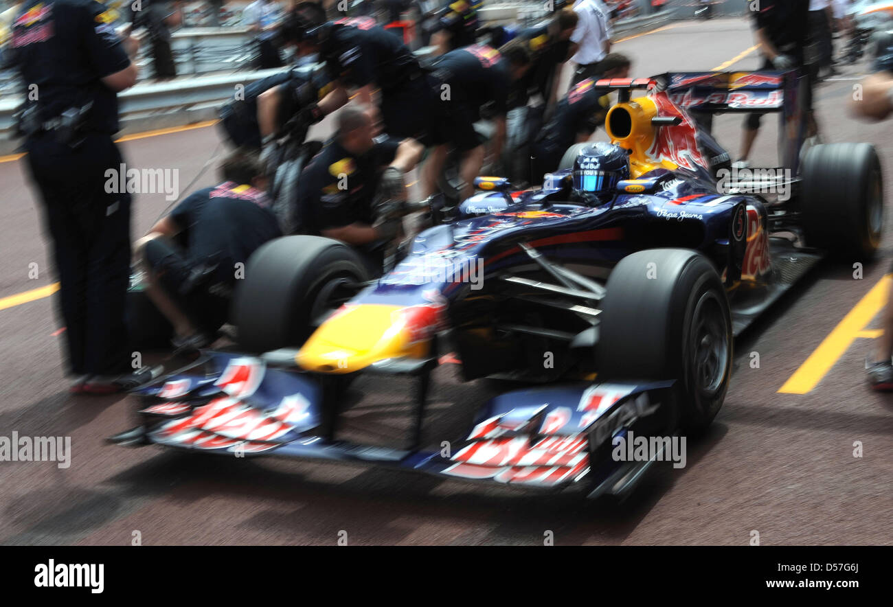 German driver Sebastian Vettel of Red Bull Racing trains a pit stop ...