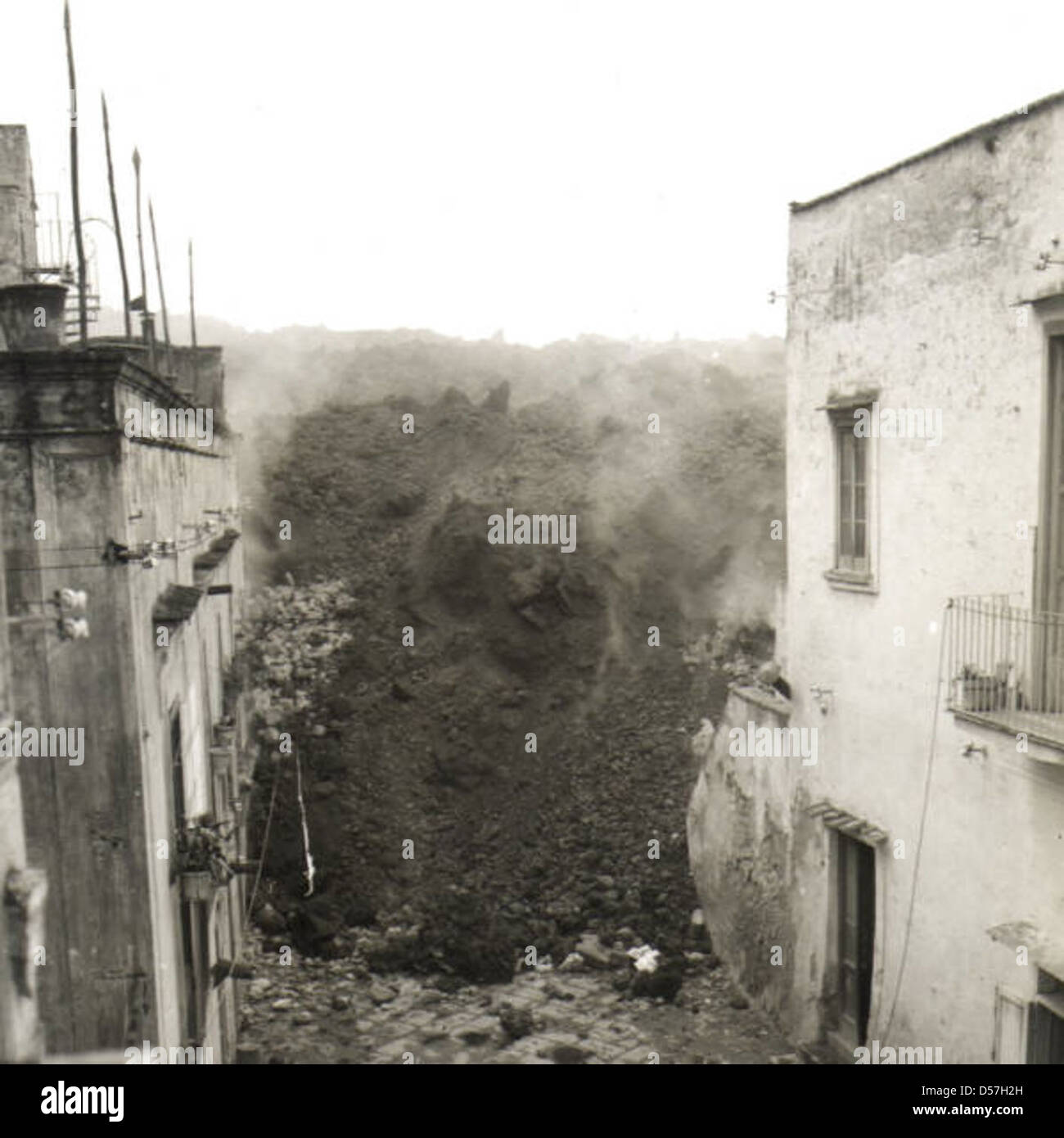 A lava flow from Mount Vesuvius engulfs a village located to the west ...