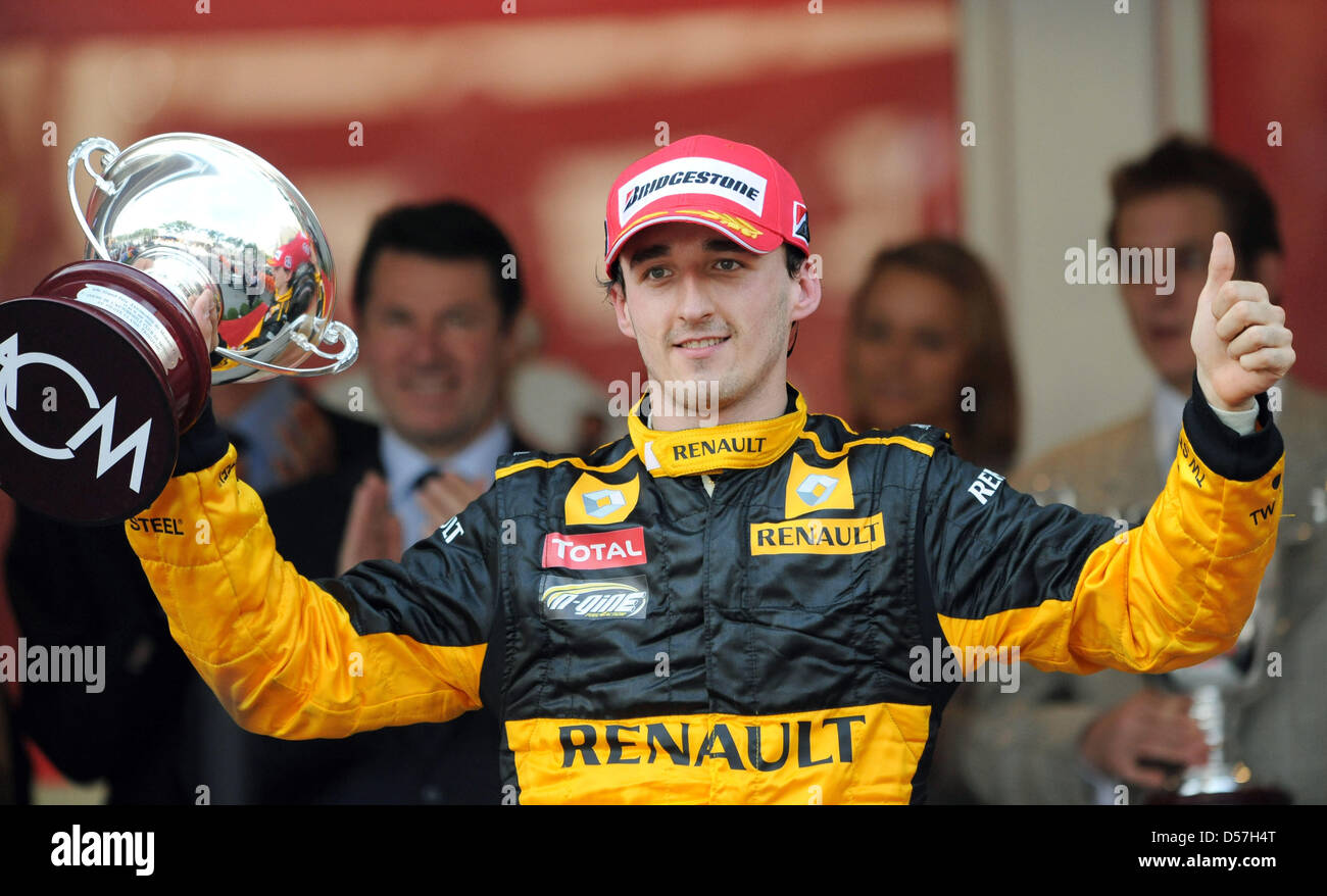 Polish driver Robert Kubica of Renault F1 celebrates his third place in ...