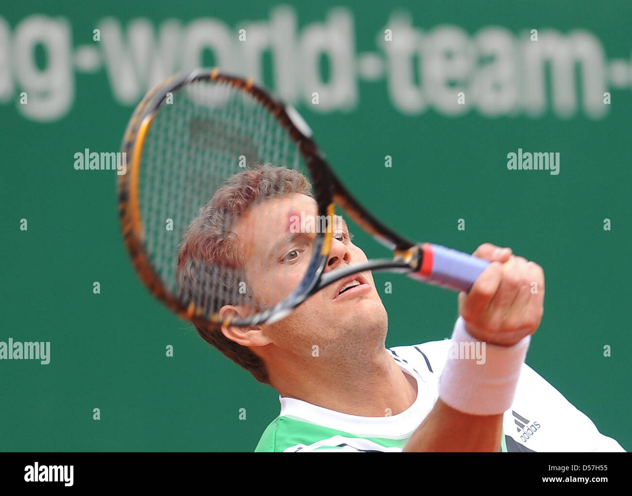 France's Paul-Henri Mathieu returns a ball to Germany's Andreas Beck ...