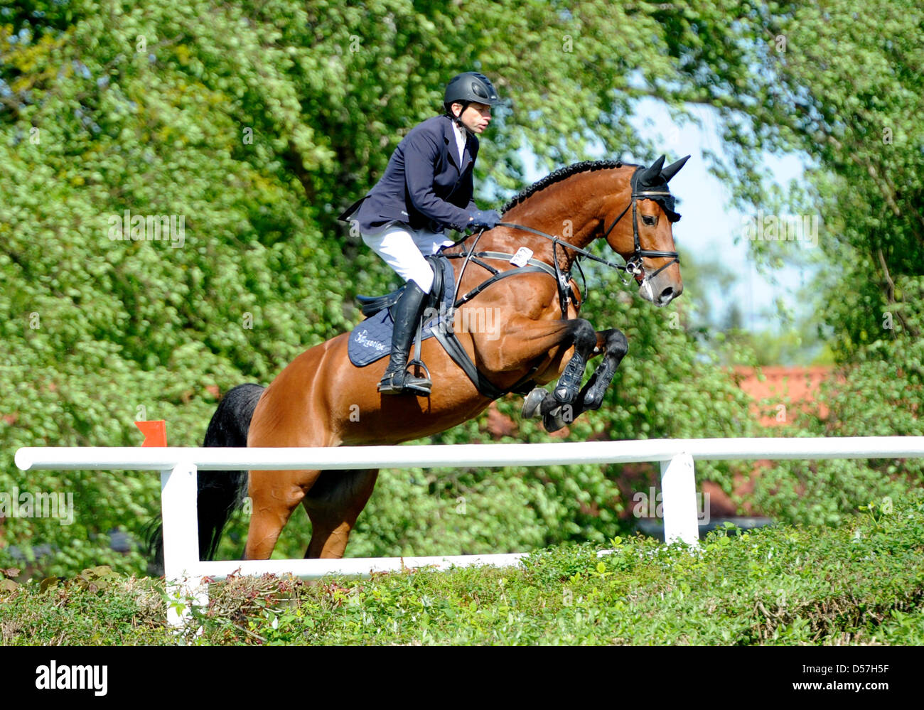 German equestrian Carsten-Otto Nagel and his horse 'Lex Lugar' take an ...