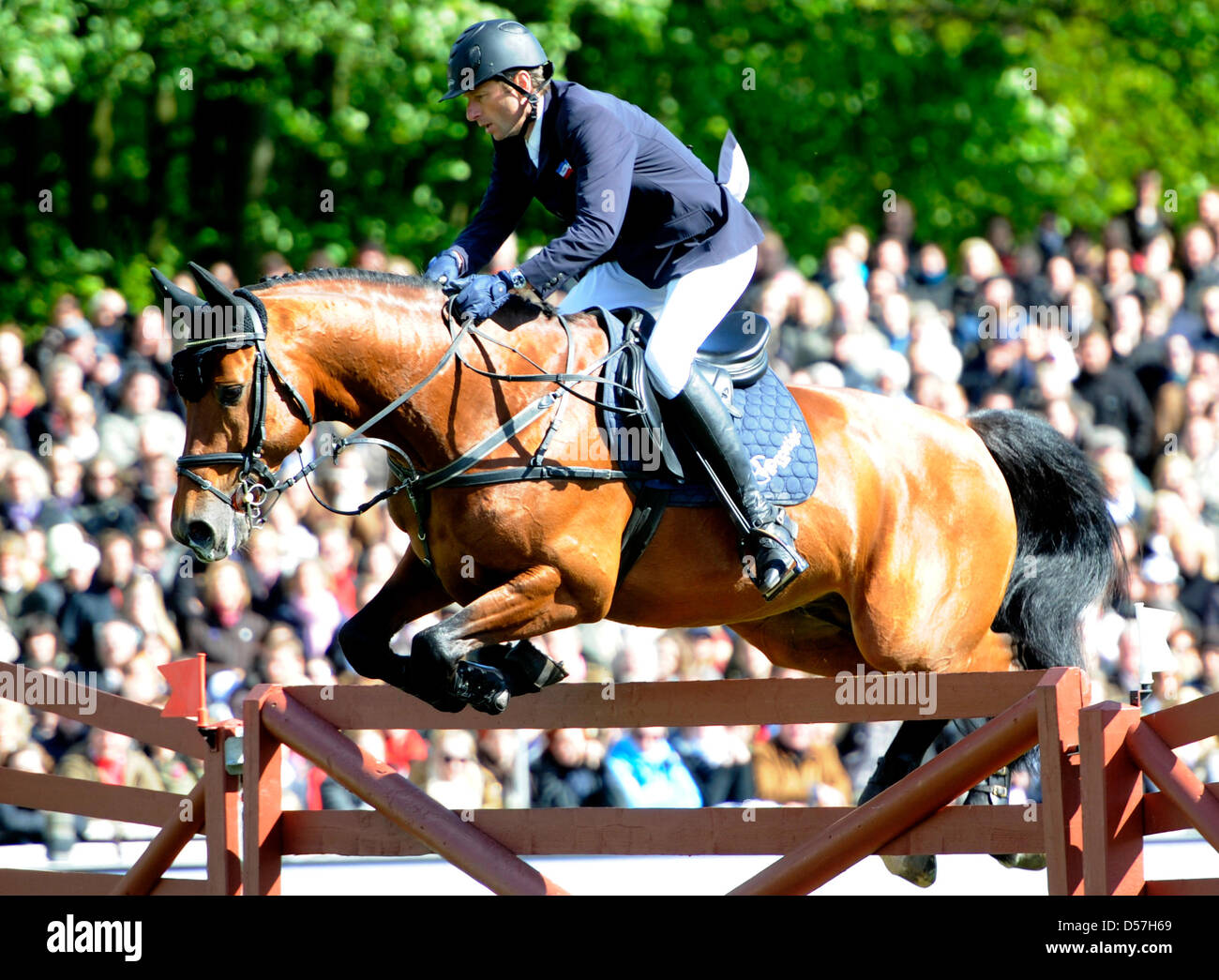 German equestrian Carsten-Otto Nagel and his horse 'Lex Lugar' take an ...