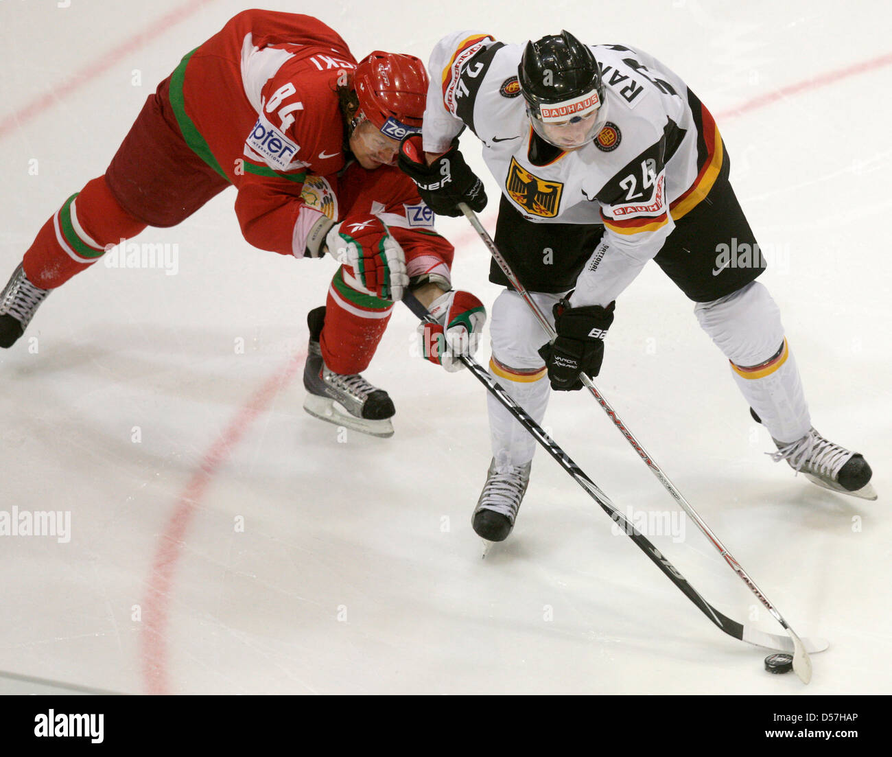Germany's Marcel Goc (L) is followed by Belarussia's Mikhail Grabovski ...