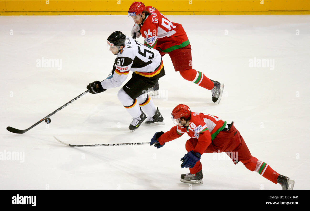 Germany's Marcel Goc (L) is followed by Belarussia's Mikhail Grabovski ...