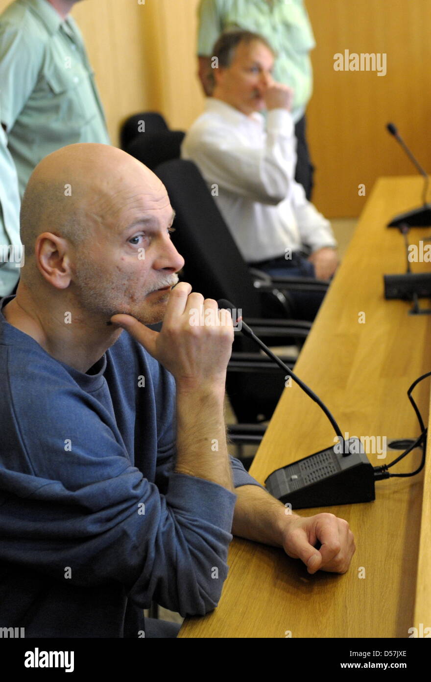 Defendants Peter Paul Michalski (front) and Michael Heckhoff sit in the ...
